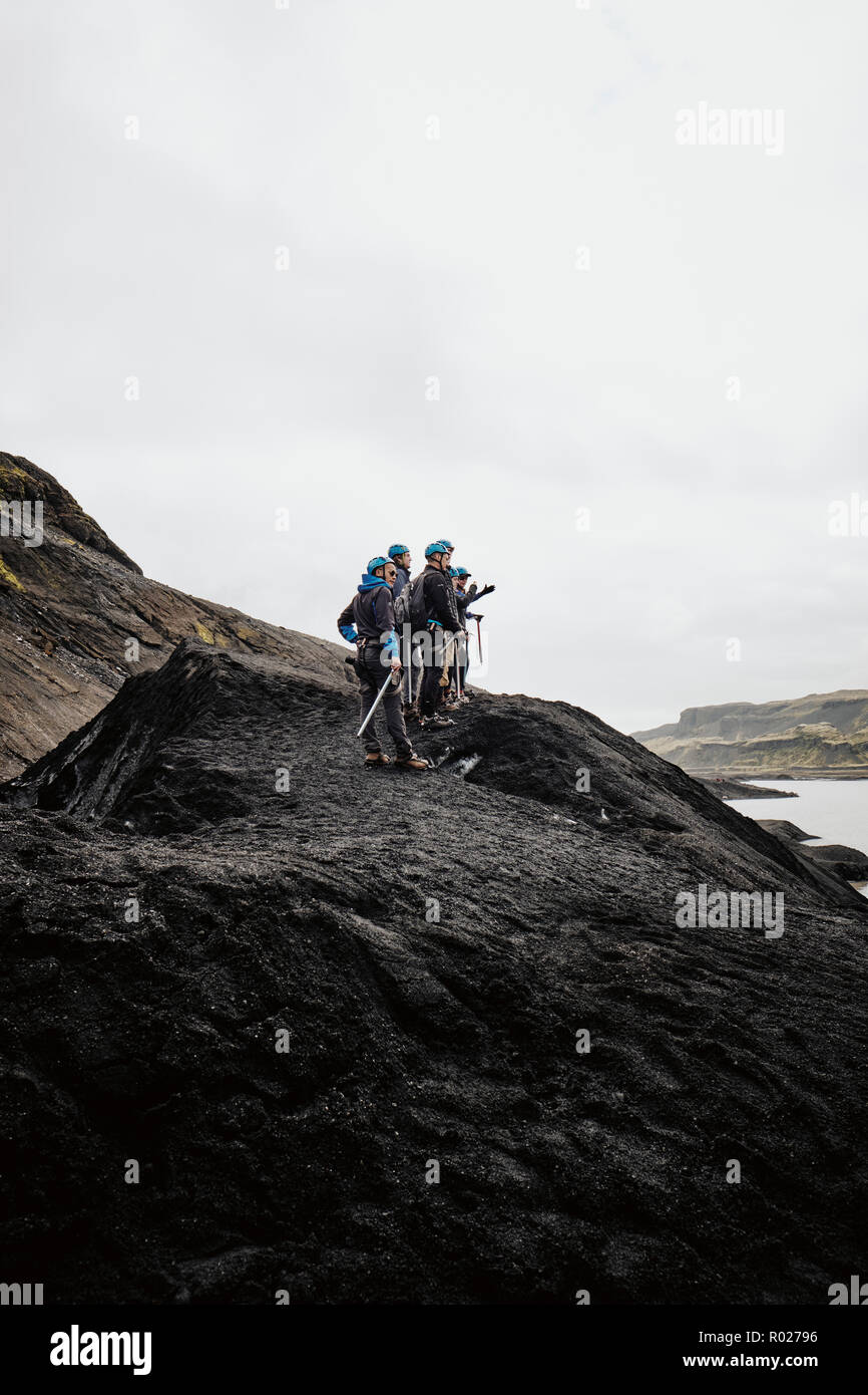 Tourists visiting the Sólheimajökull glacier part of the larger ...