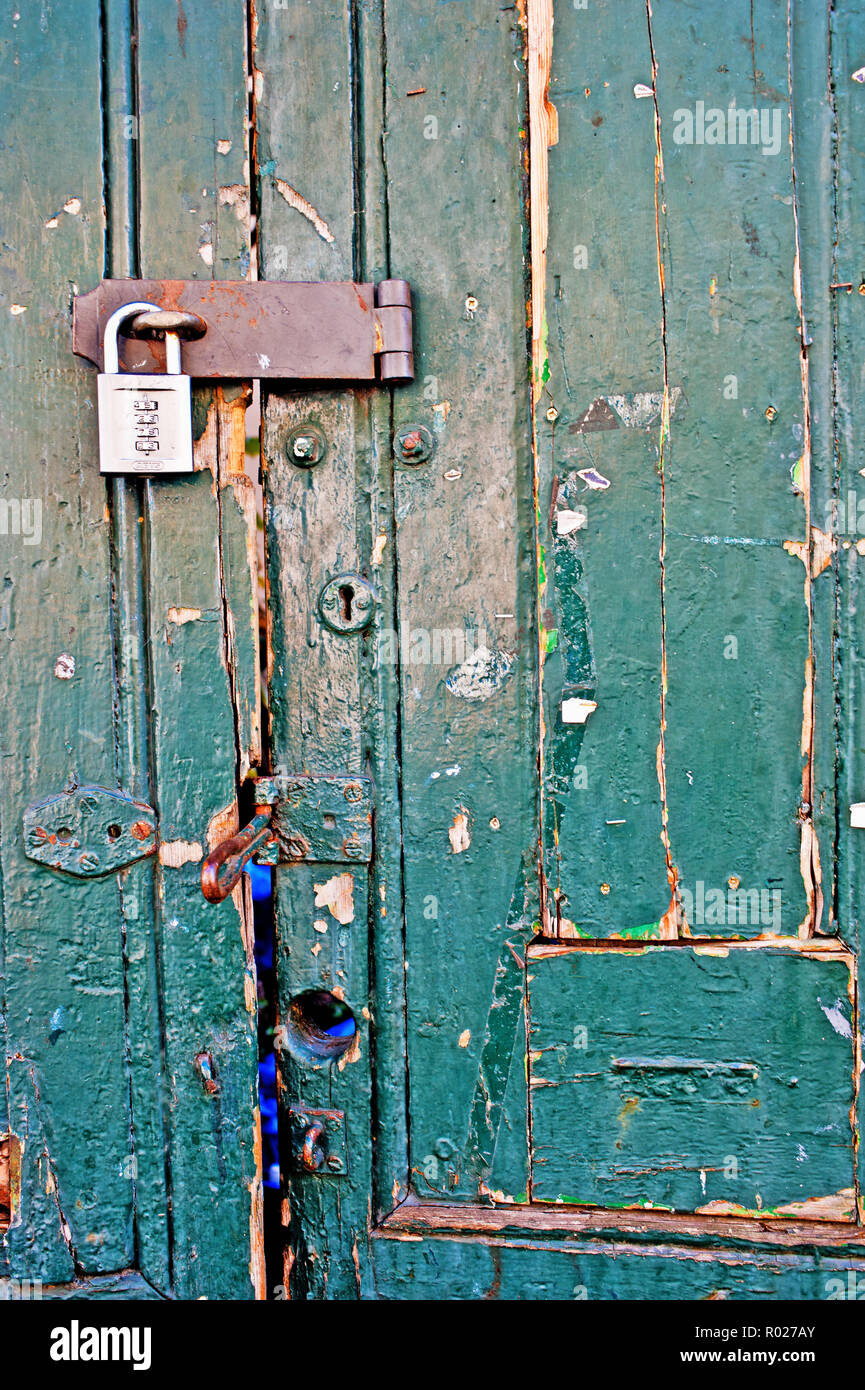 Locked green painted wooden door Stock Photo - Alamy