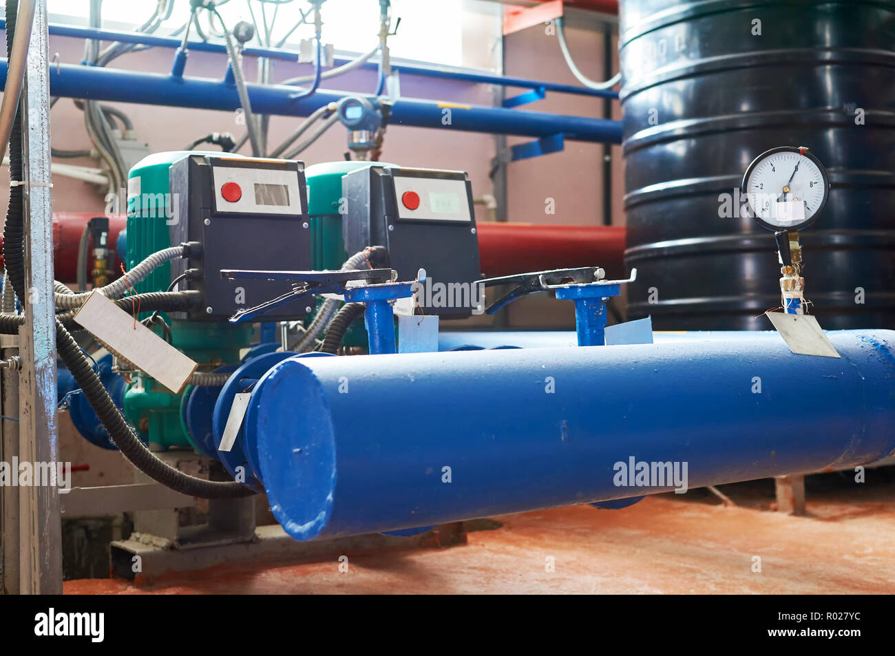 Blue pump motor and the inverter connected to the pipes blue Stock ...