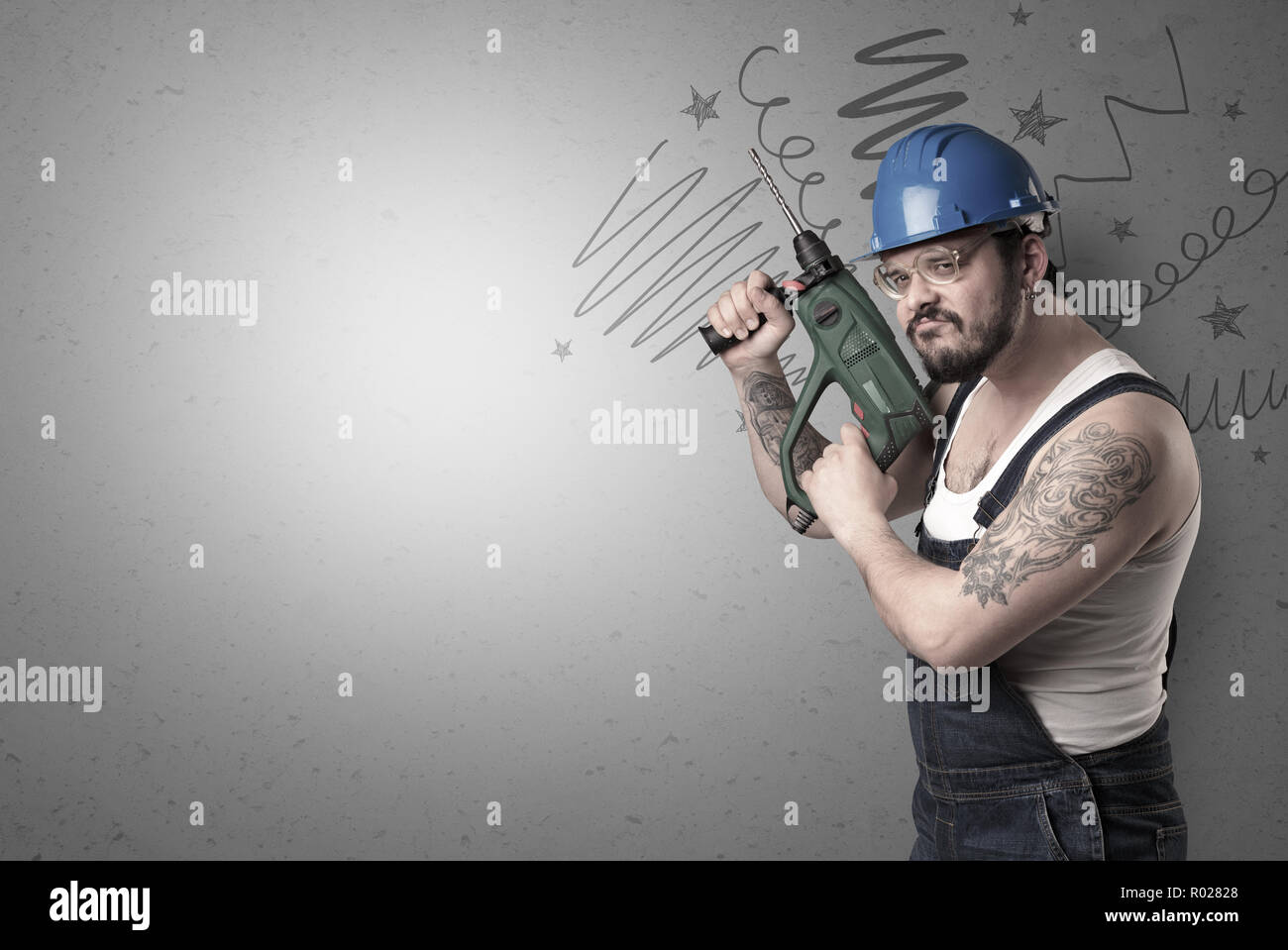 Handyman with tool in his hand and hand drawn lines above Stock Photo ...