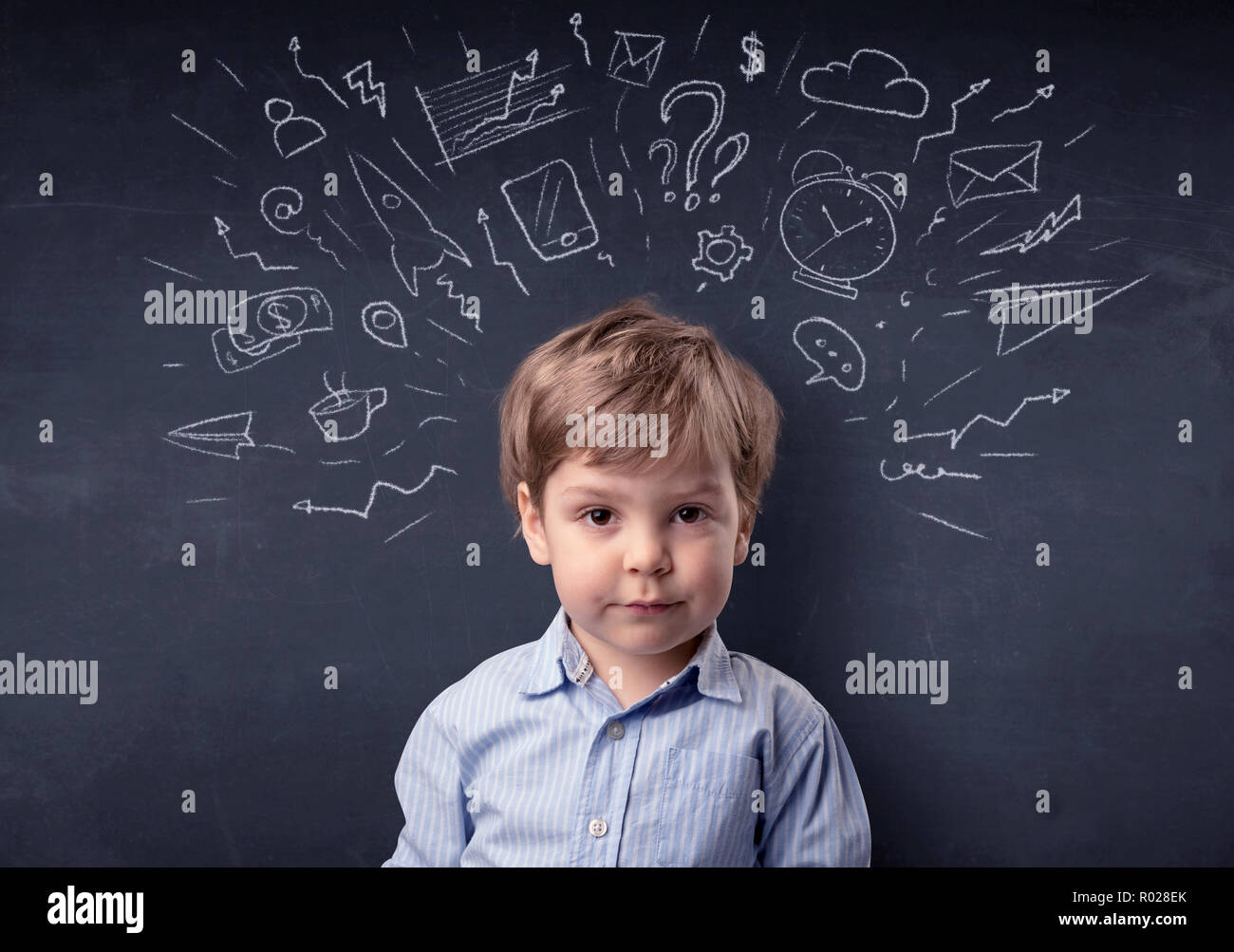 Smart little kid in front of a drawn up blackboard ruminate Stock Photo ...
