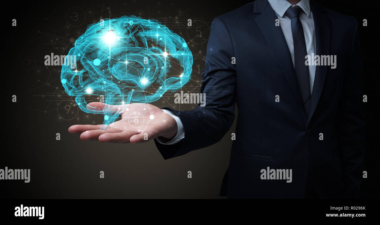 Businessman holding human brain on his hand with logistics symbols ...