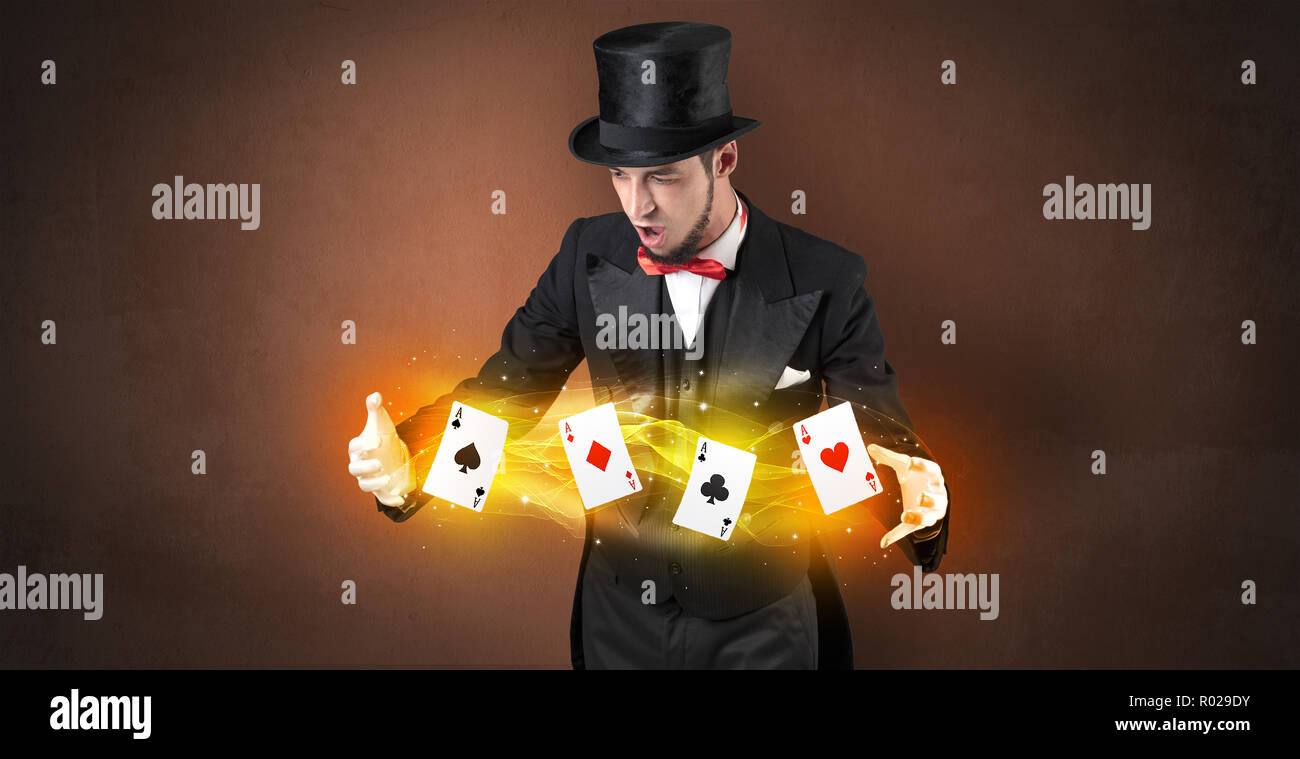 Illusionist in tails bandy play cards between his two hands Stock Photo ...