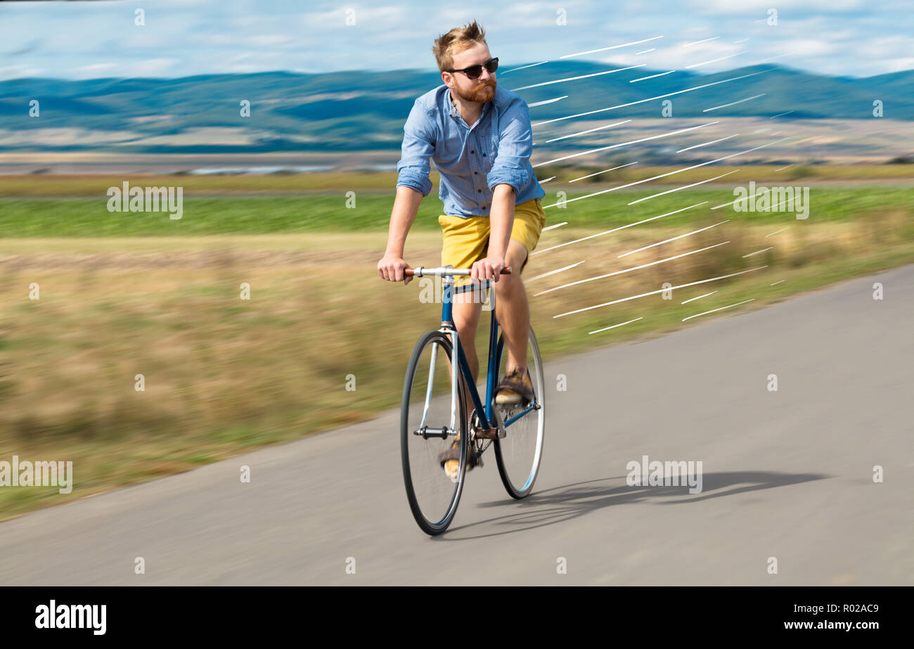 Casual hipster cyclist riding bicycle with high speed concept Stock ...