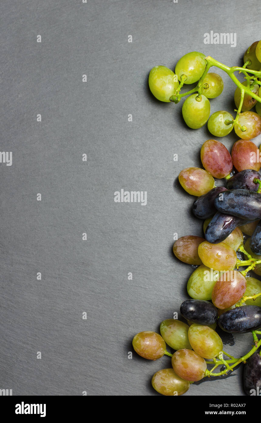 Grapes on dark background with copy space. Vertical frame Stock Photo ...