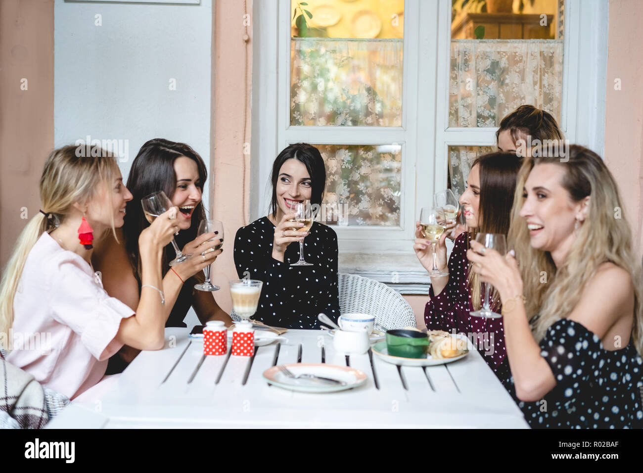 Six girls at the table Stock Photo - Alamy