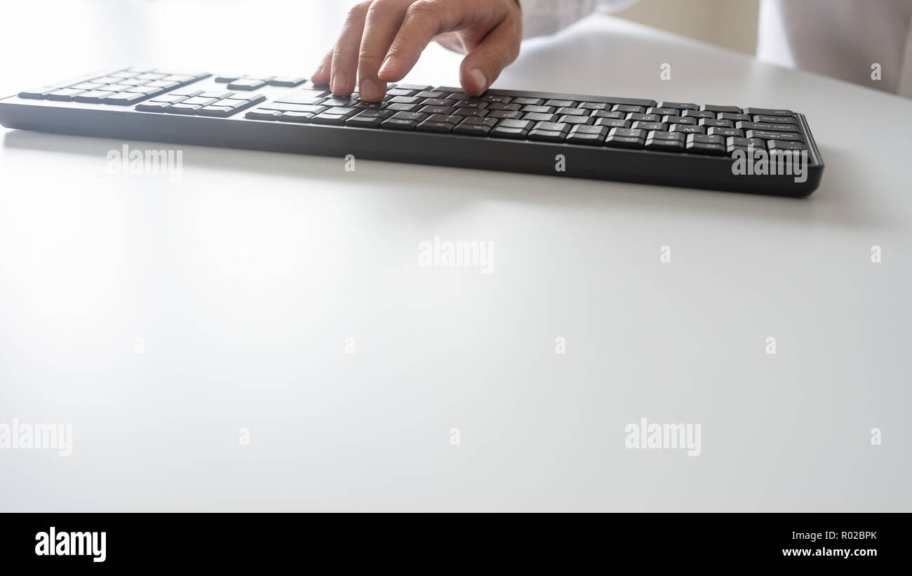 Male hand using black computer keypad. With copy space Stock Photo - Alamy