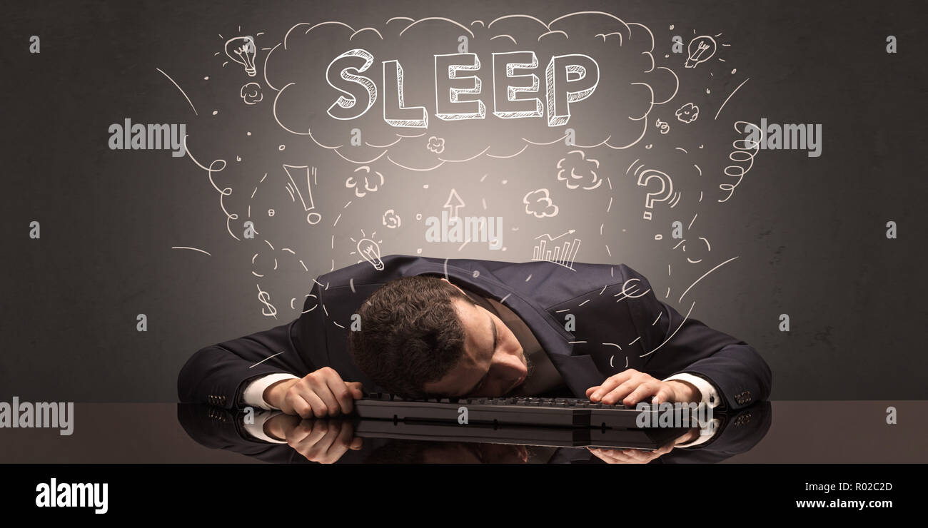 Young elegant businessman fell asleep at his workplace with doodled ...