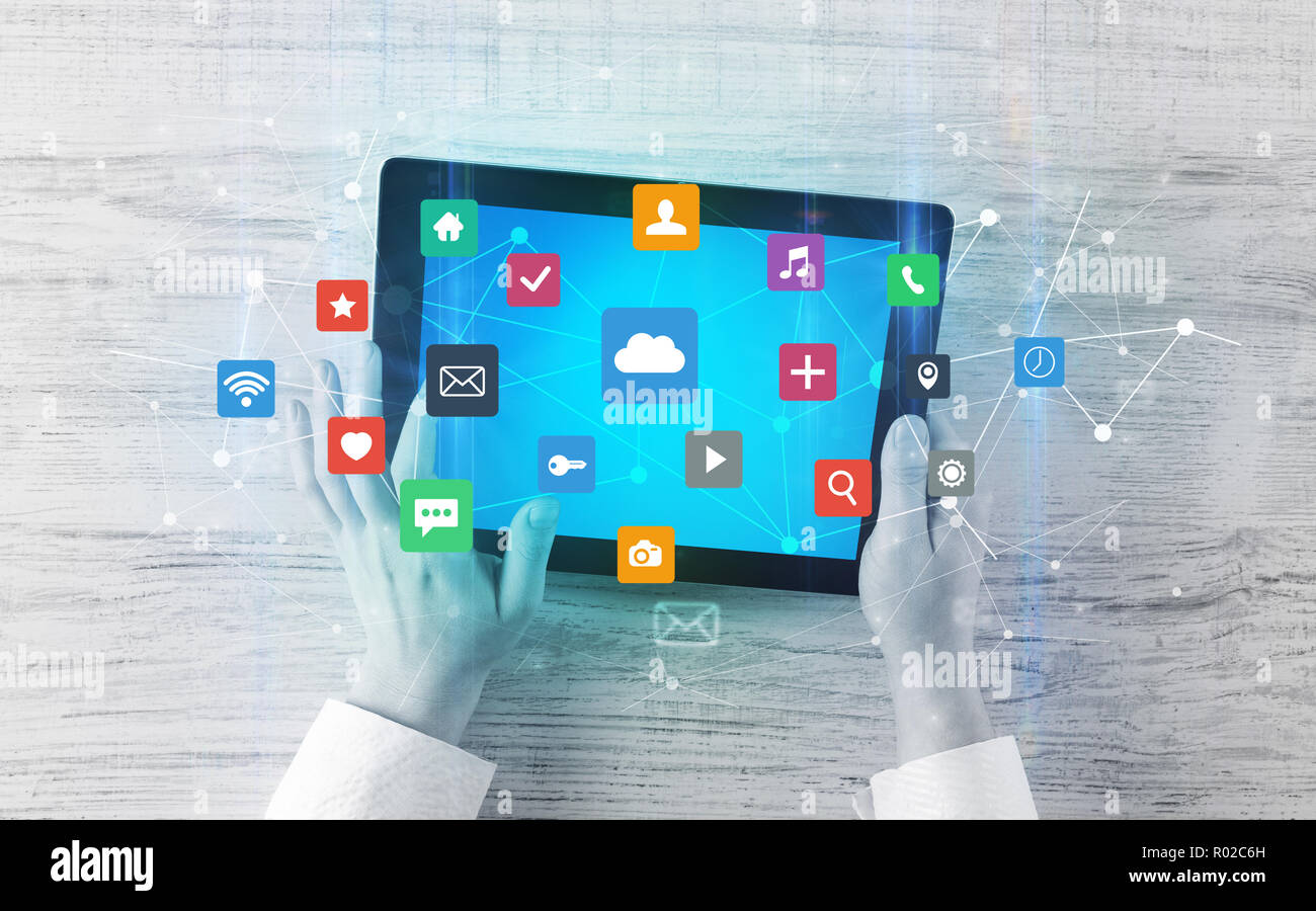 Hand touching multitask tablet with cloud wifi message social media ...