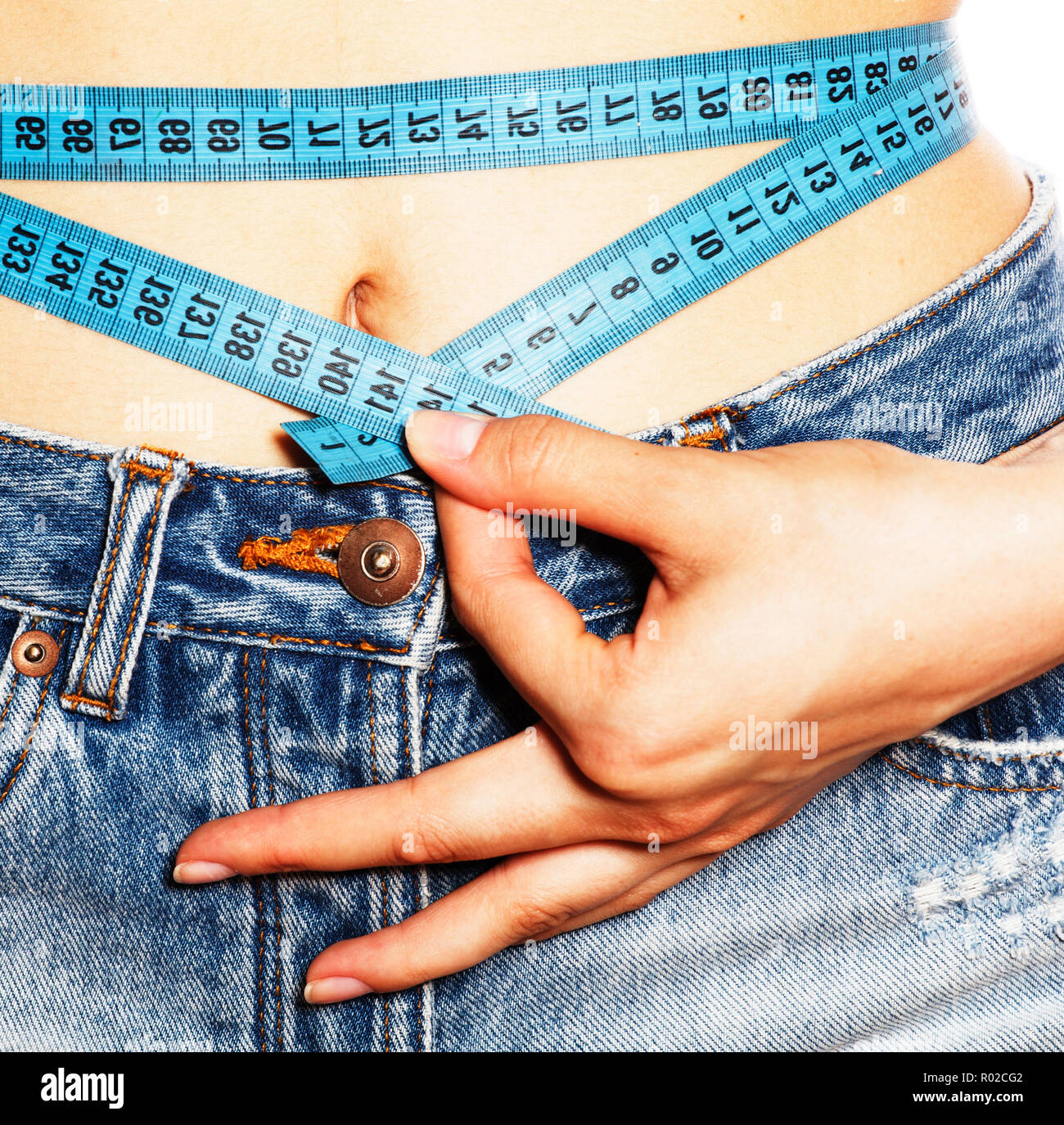 girls stomach measuring with tape twice isolated close up Stock Photo ...