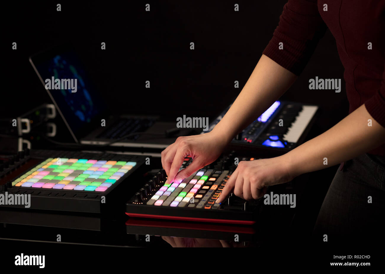 Dj hand remixing music on midi controller Stock Photo - Alamy