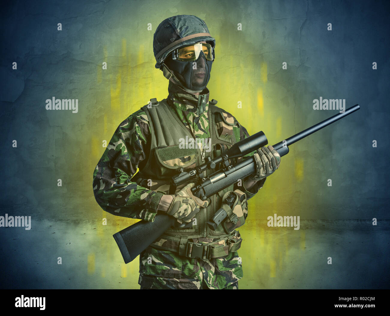 Hazard, menace soldier in a ruined crumbly building with arms on his ...