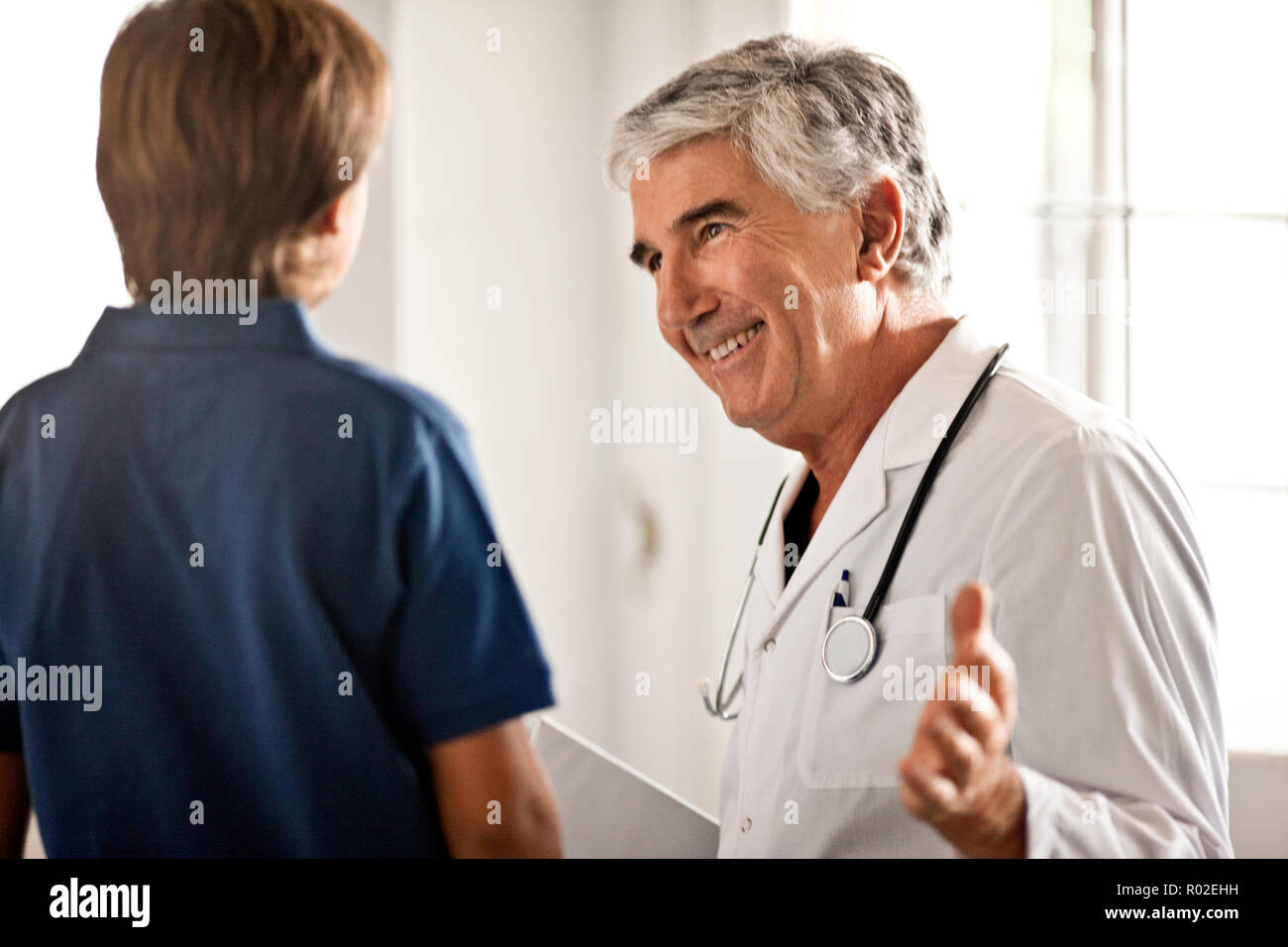 Young boy getting a checkup at the doctor's office Stock Photo - Alamy