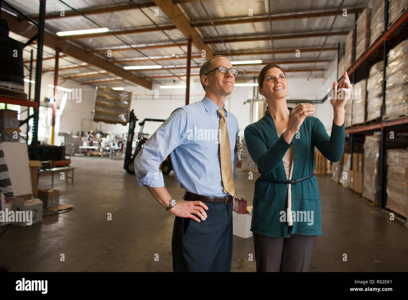 Two colleagues discussing work in a brewery Stock Photo - Alamy