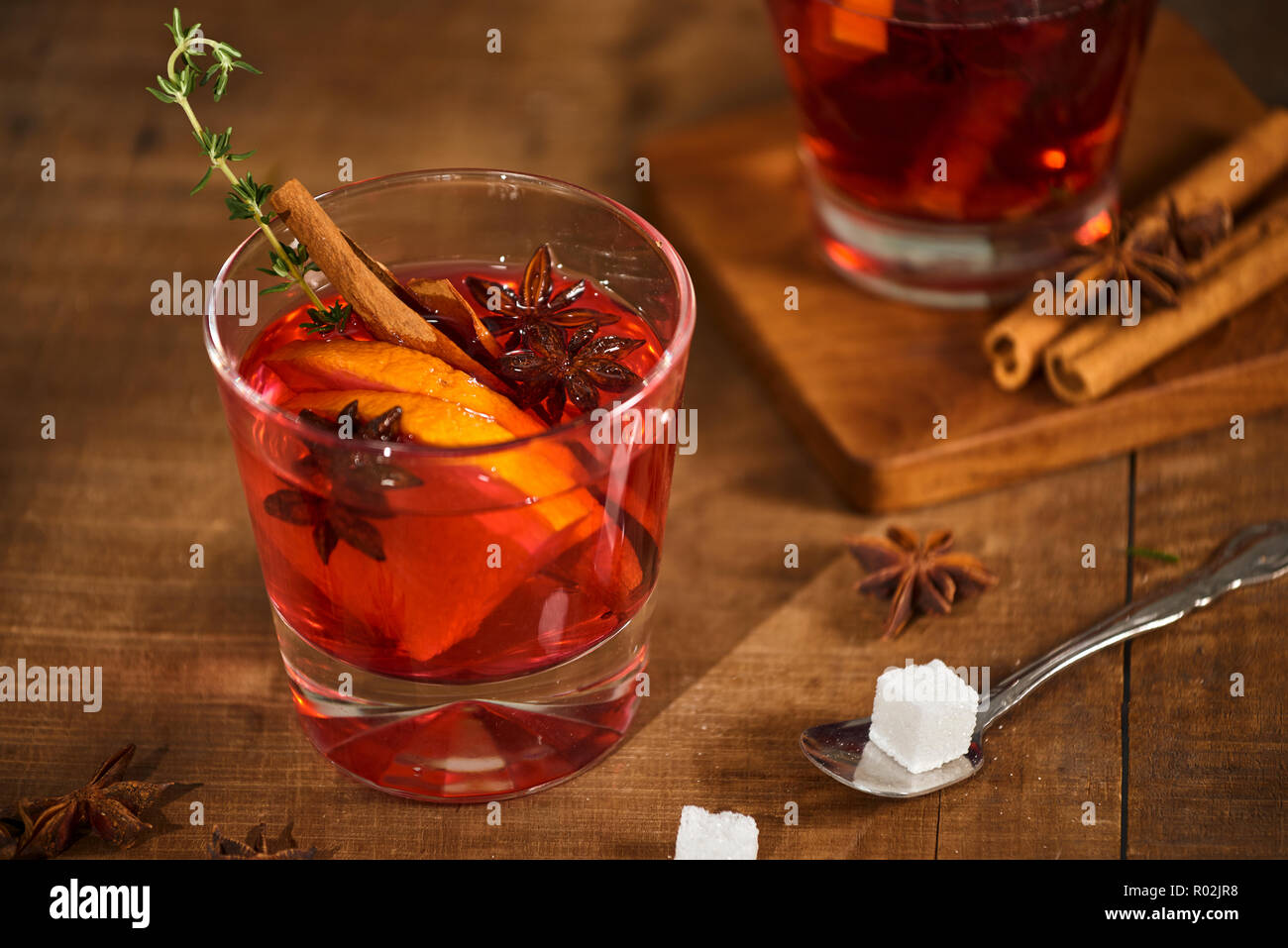 Cold ginger tea with orange and lemon in glass cups. Tea with sugar ...