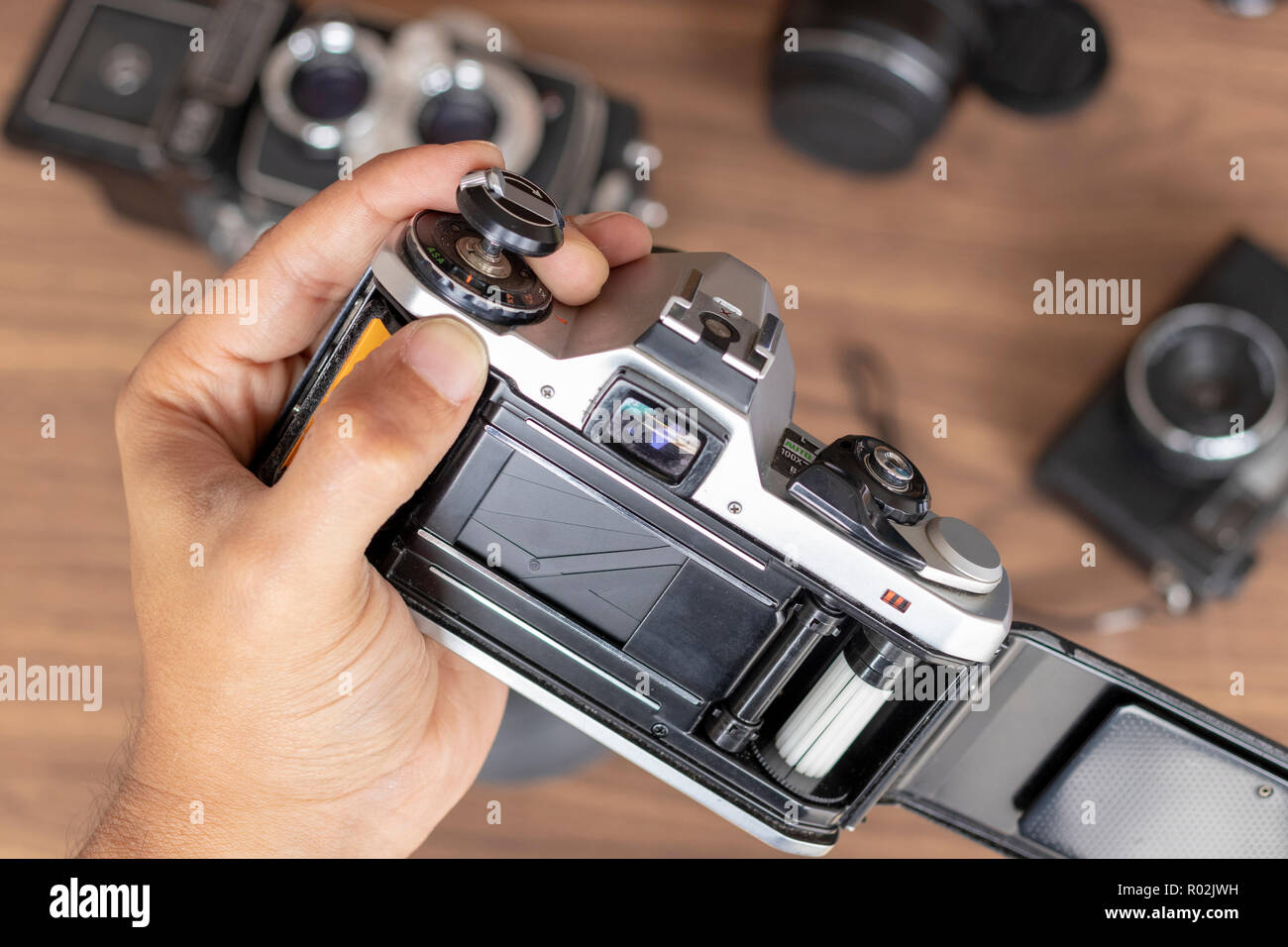 Placing photographic roll in a camera Stock Photo - Alamy
