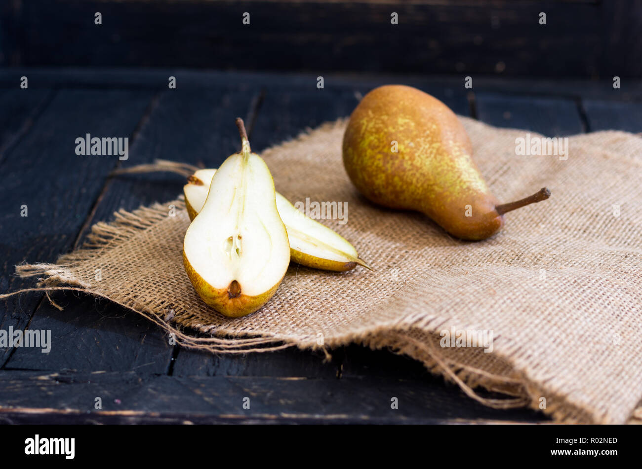 Italian pear. Pear Bera. Fresh fruit. Dark rural appearance Stock Photo ...