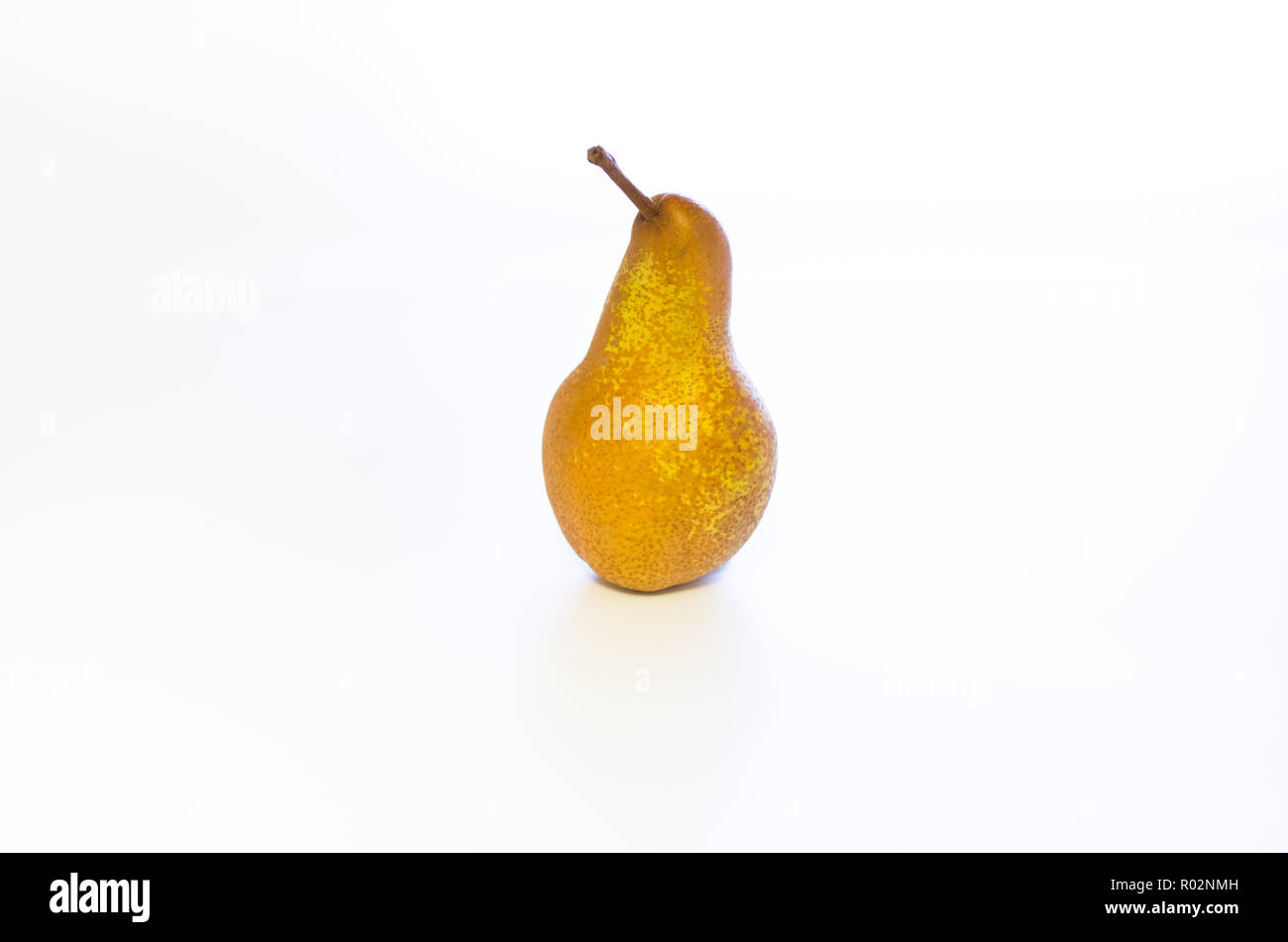 One pear on a white background. Yellow pear on white. Front view Stock ...