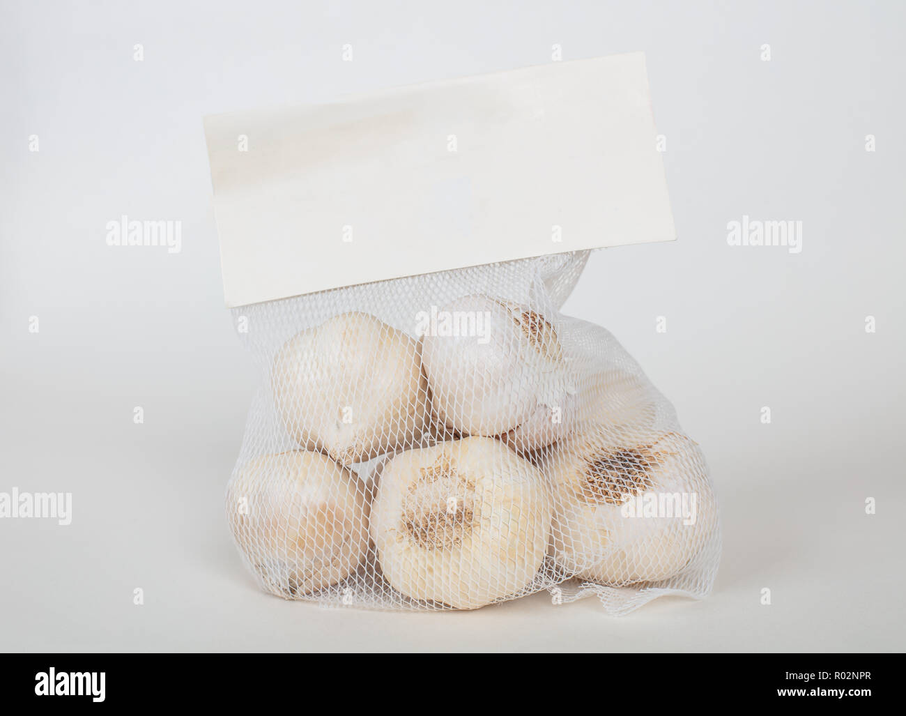 Garlics in package with blank label ready to sell, isolated on white ...