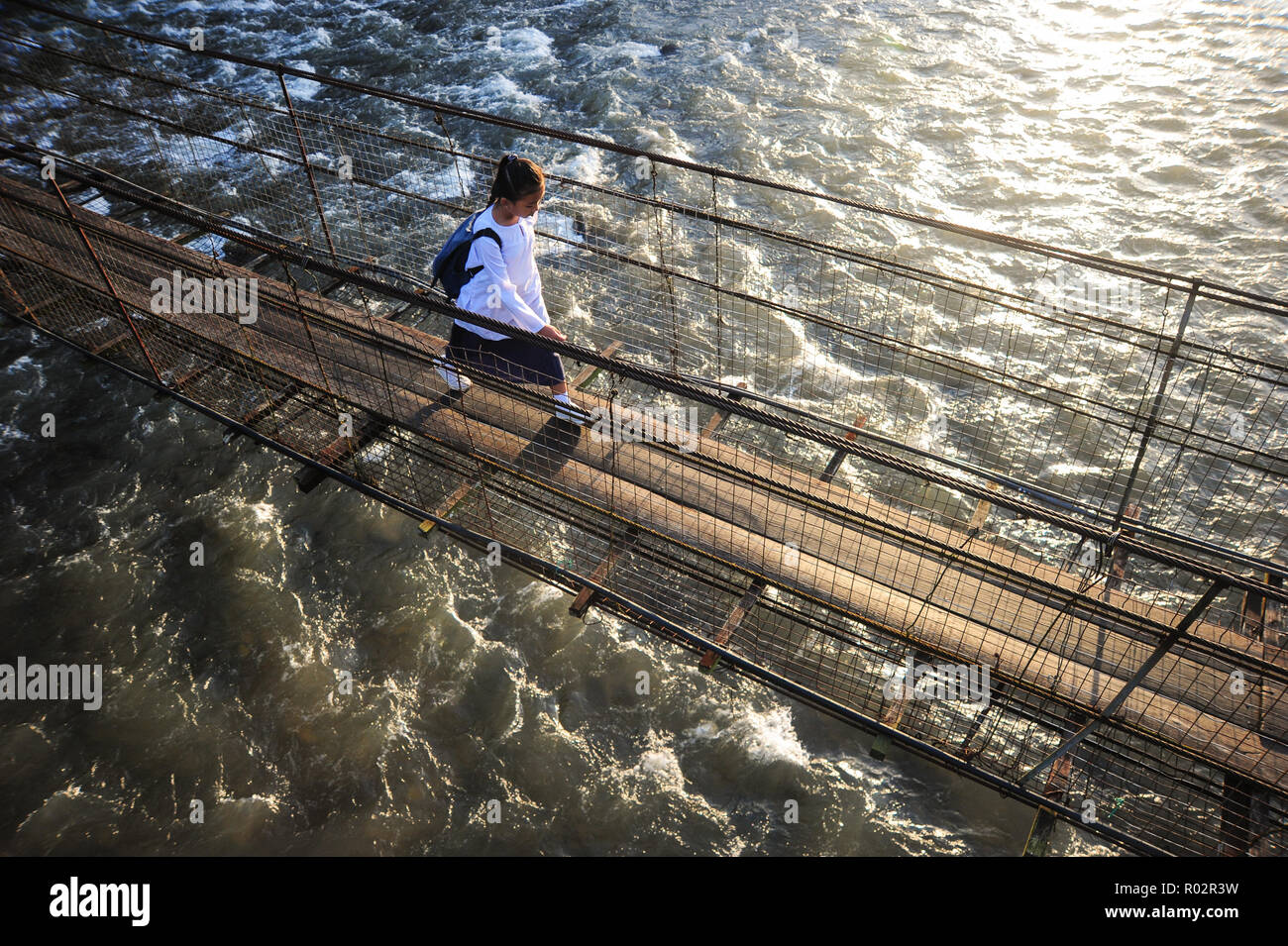 Kiulu Sabah Malaysia - Feb 5, 2018 : Rural kids walking on suspension ...