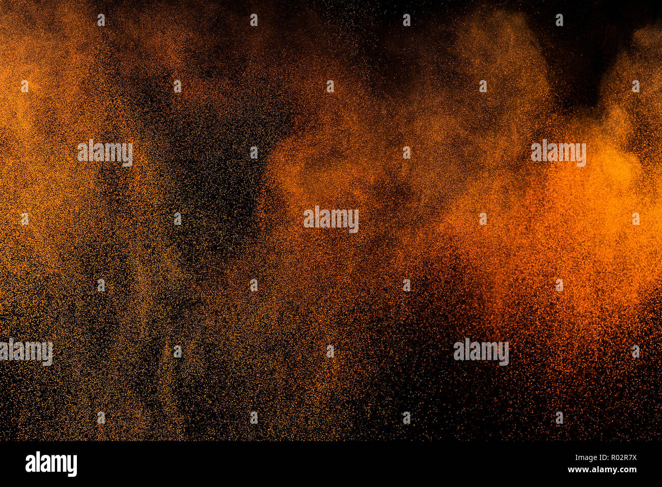 Abstract orange paint Holi. Abstract orange powder explosion on black ...