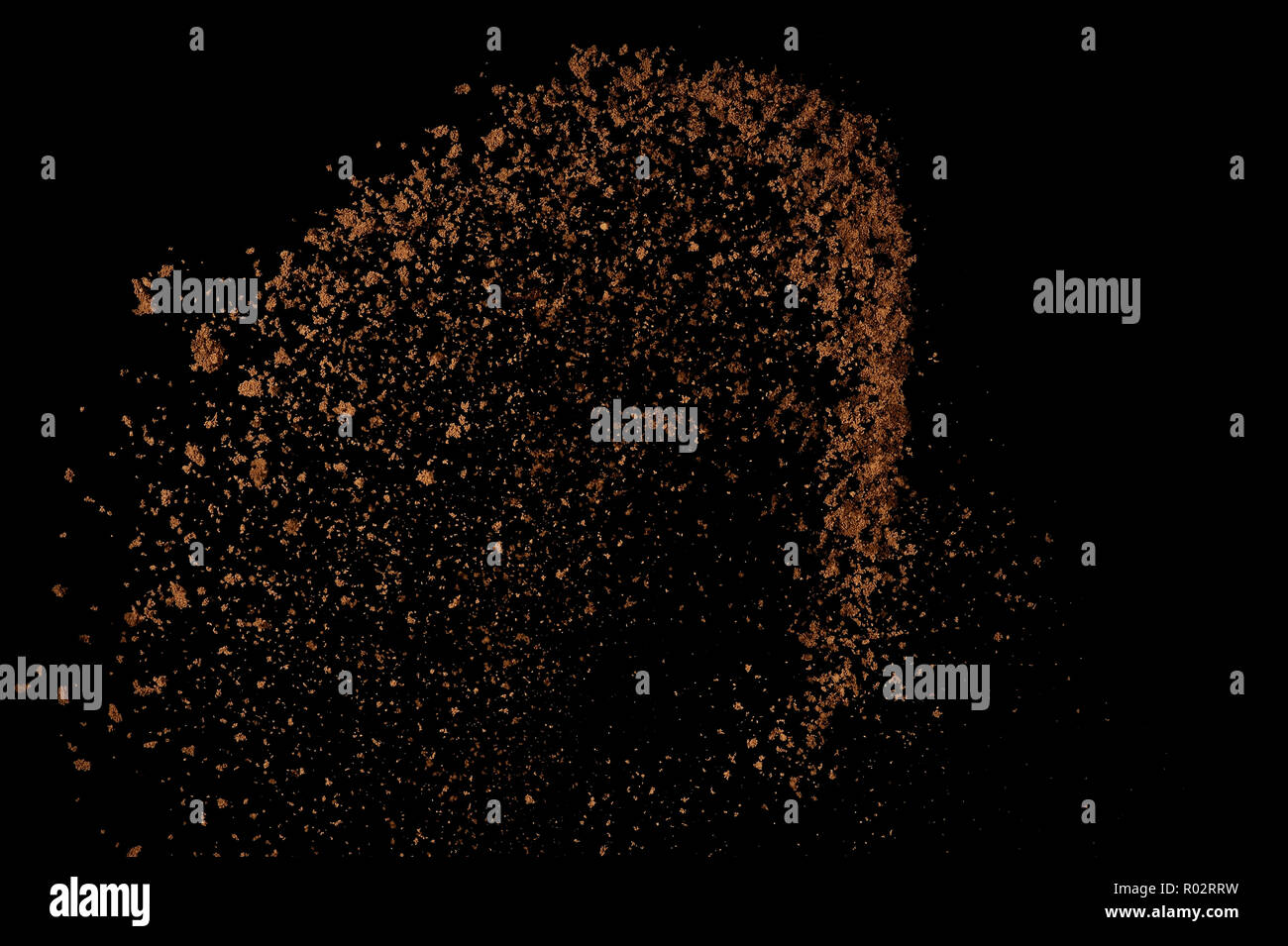 Soil explosion isolated on black background. Abstract cloud of brown ...