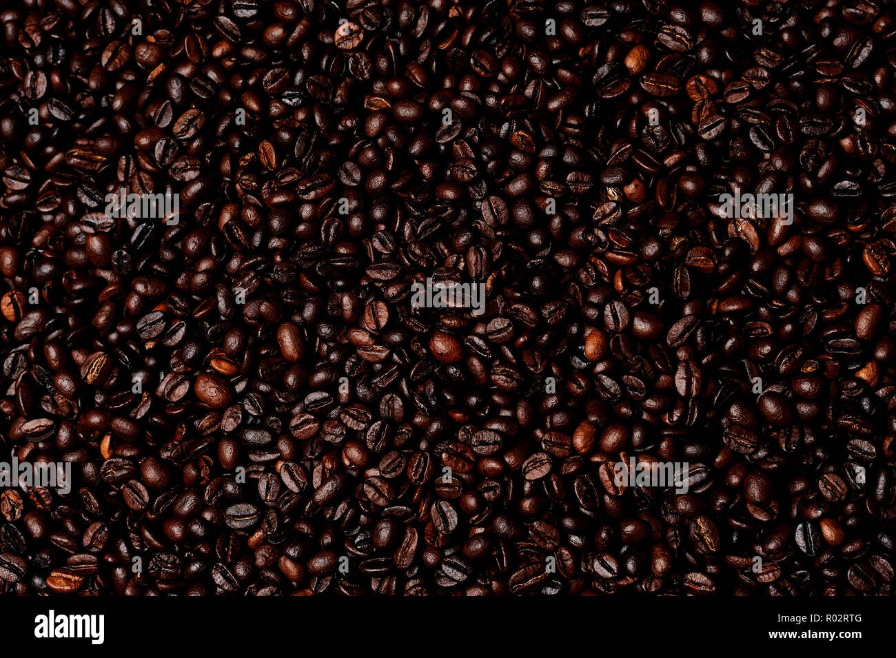 Coffee beans closeup background. Roasted coffee grains Stock Photo - Alamy