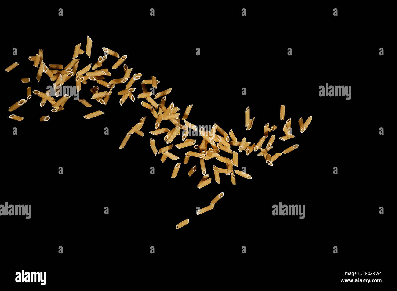 Flying pasta isolated on black background. Abstract macaroni falling ...