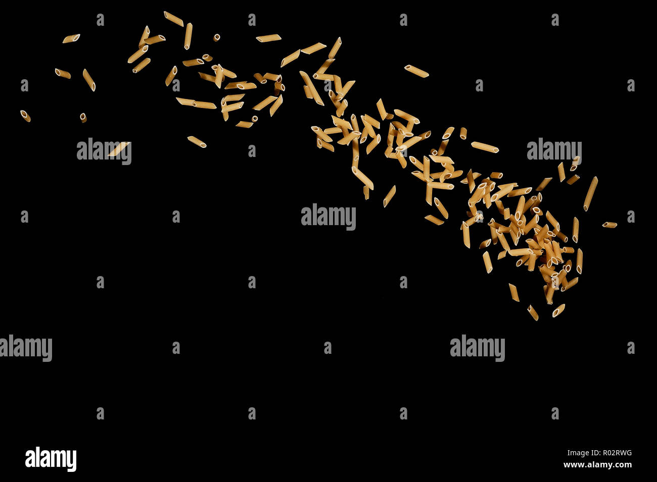 Flying pasta isolated on black background. Abstract macaroni falling ...