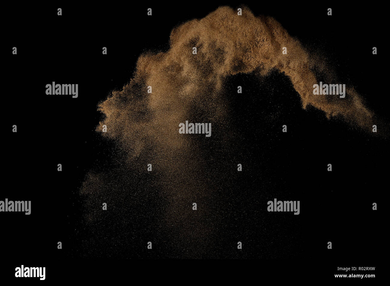 Sandy explosion isolated on black background. Abstract sand cloud Stock ...