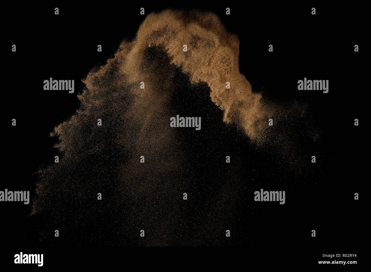 Sandy explosion isolated on black background. Abstract sand cloud Stock ...