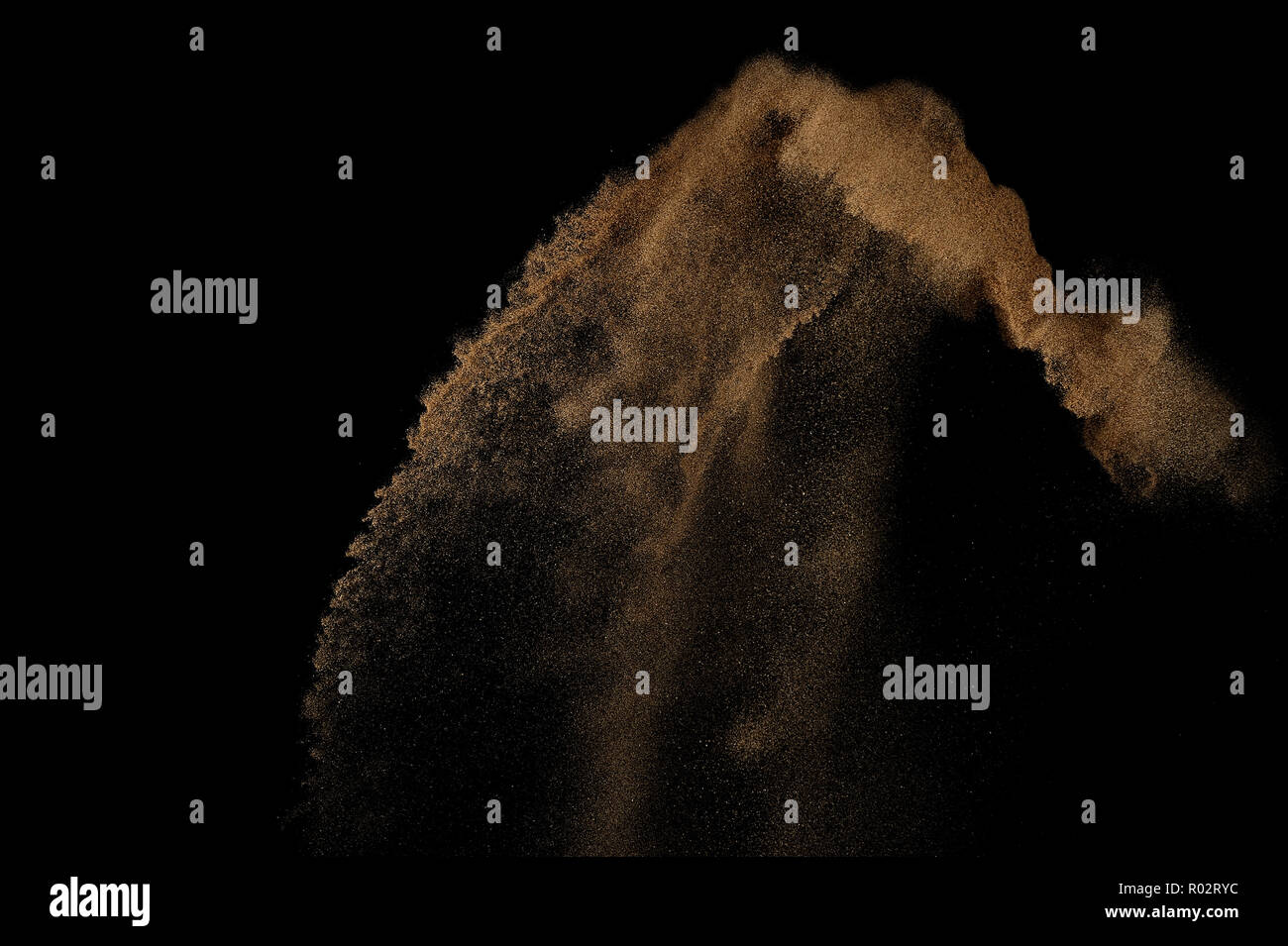 Sandy explosion isolated on black background. Abstract sand cloud Stock ...