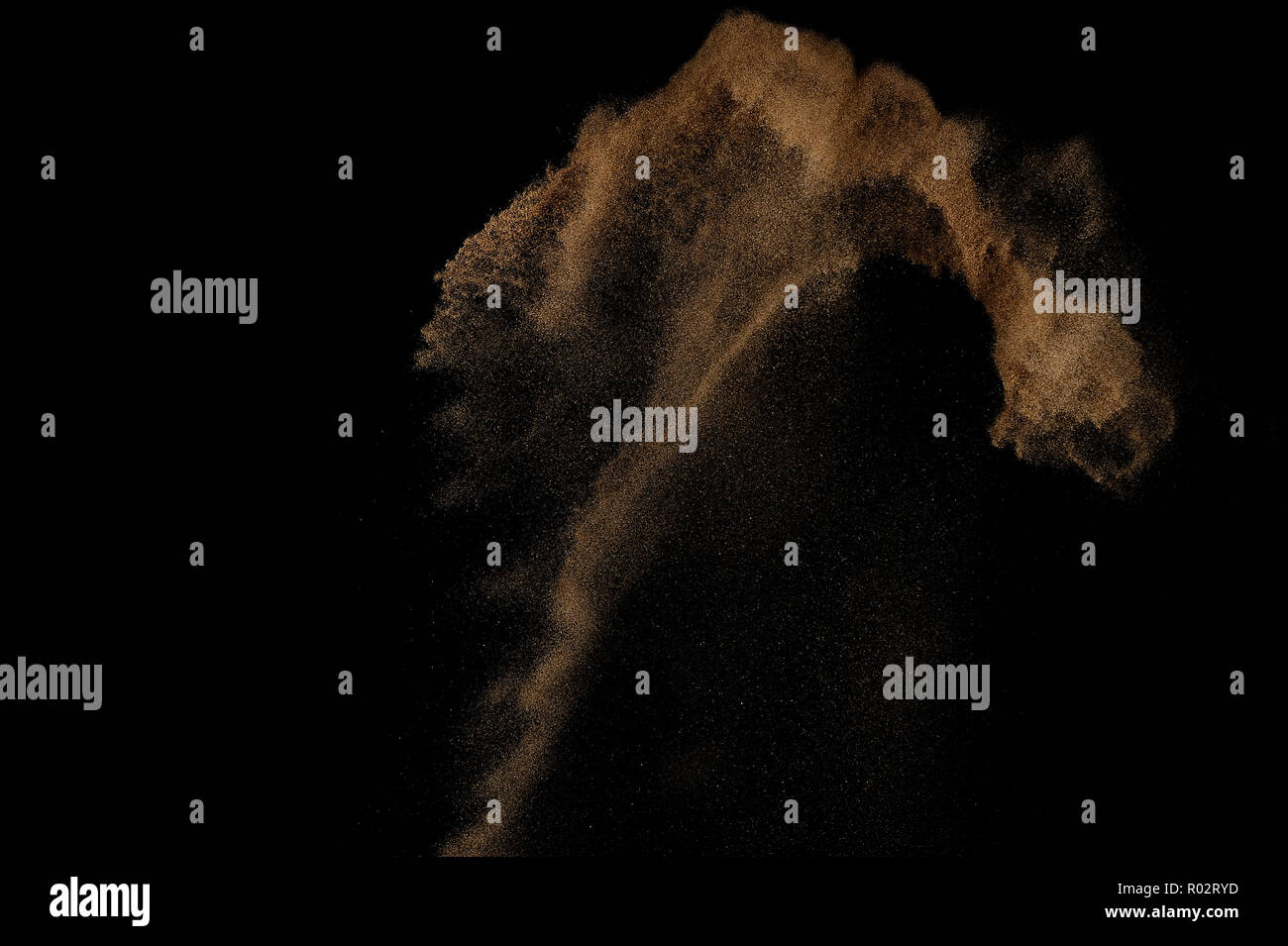 Sandy explosion isolated on black background. Abstract sand cloud Stock ...