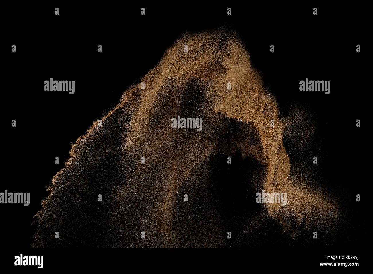 Sandy explosion isolated on black background. Abstract sand cloud Stock ...