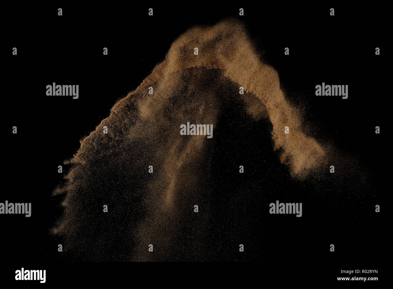 Sandy explosion isolated on black background. Abstract sand cloud Stock ...