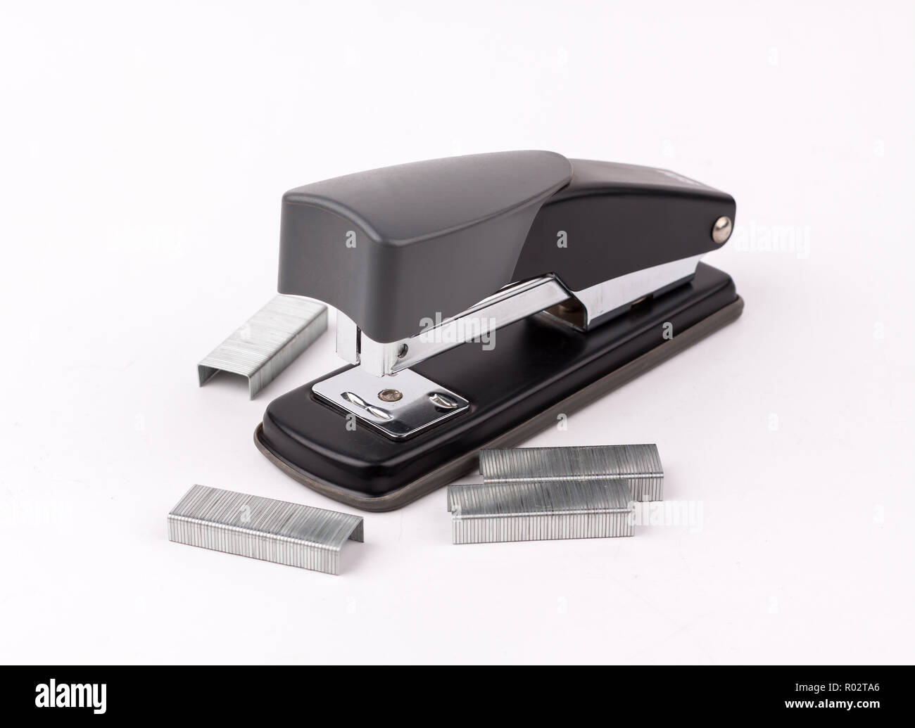 black Stapler with staples wires on white background Stock Photo - Alamy