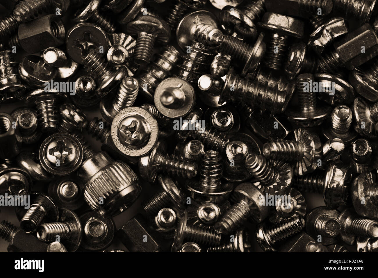 Dark tone of Bolts and nuts screws texture background Stock Photo - Alamy
