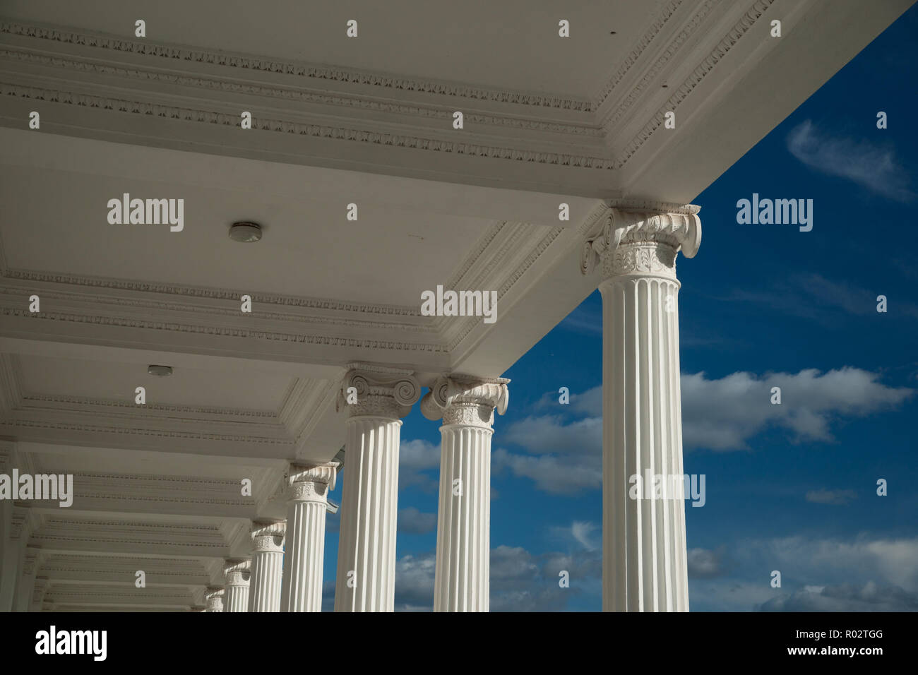 Columns on blue sky background Stock Photo - Alamy