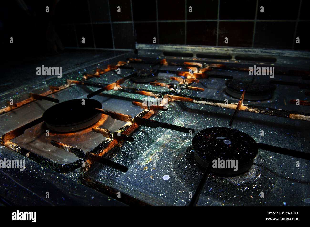 What at first glance a clean gas cooker reveals dirt, splattered oil ...