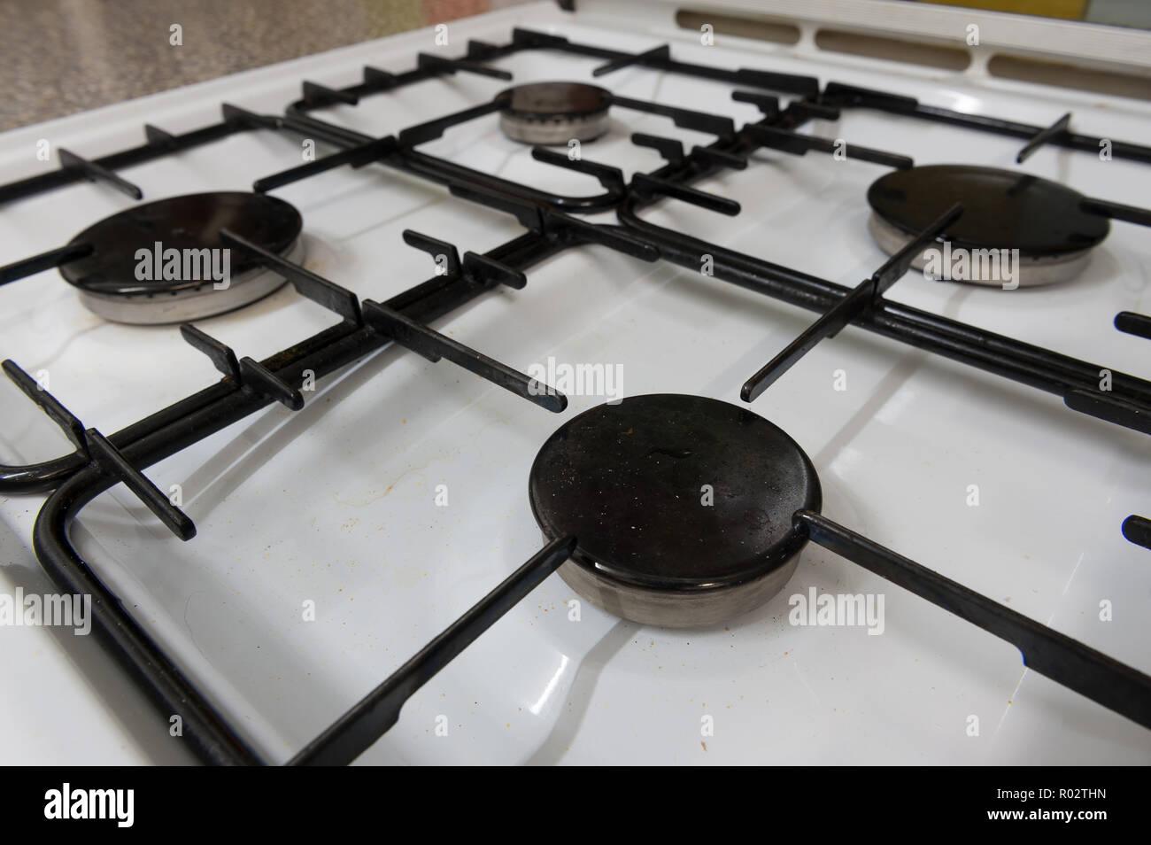 What at first glance a clean gas cooker reveals dirt, splattered oil ...