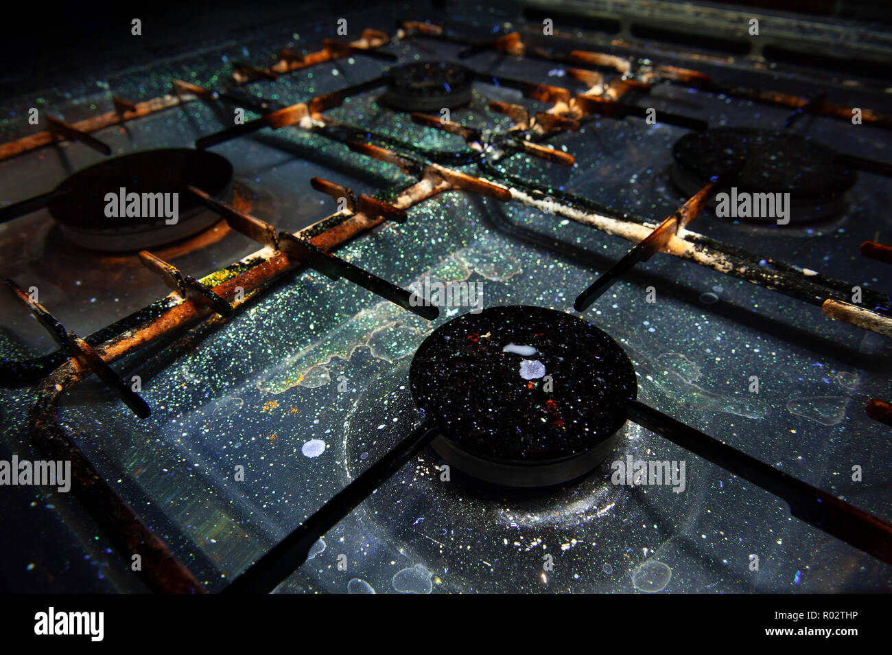 What at first glance a clean gas cooker reveals dirt, splattered oil ...