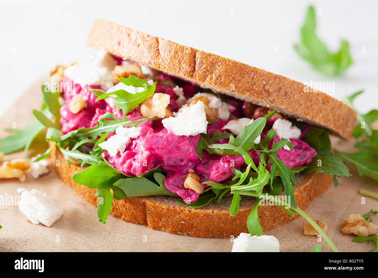 beetroot and feta cheese sandwich with walnuts and rocket Stock Photo ...