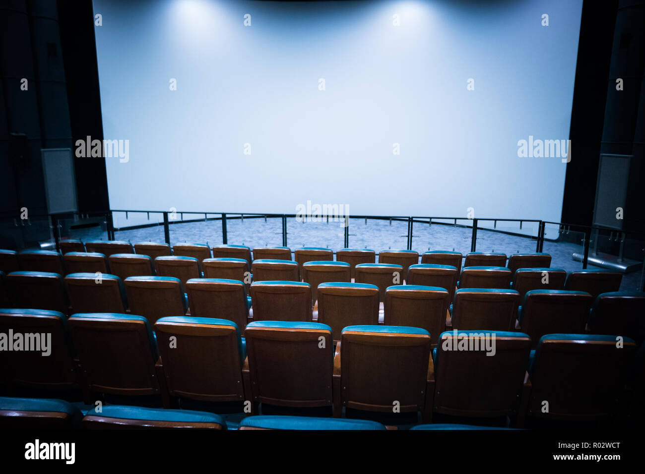 Empty stage in the small movie theater with white screen Stock Photo ...