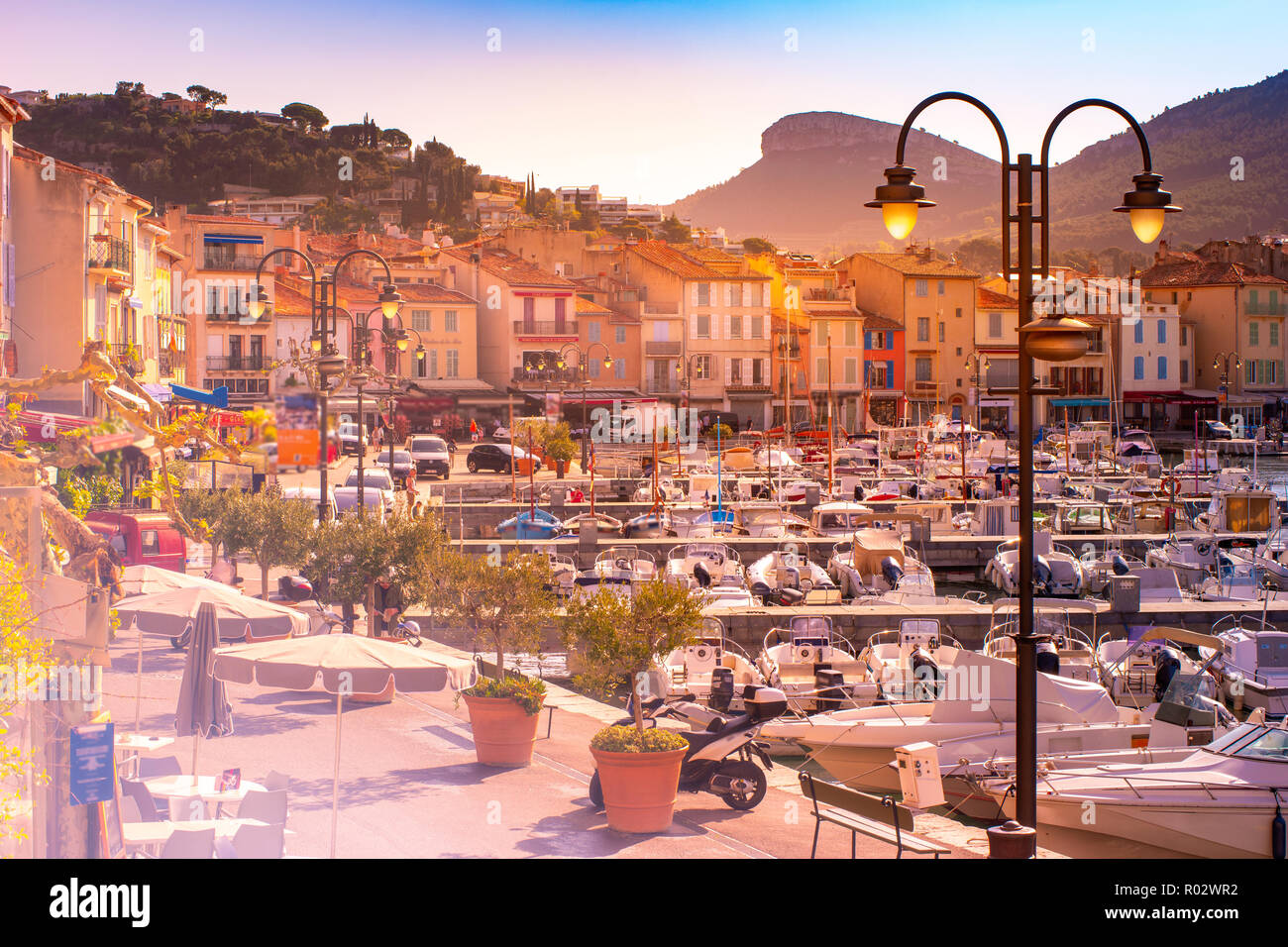 Chateau de Cassis castle on top of hill and close up of boats moored in ...