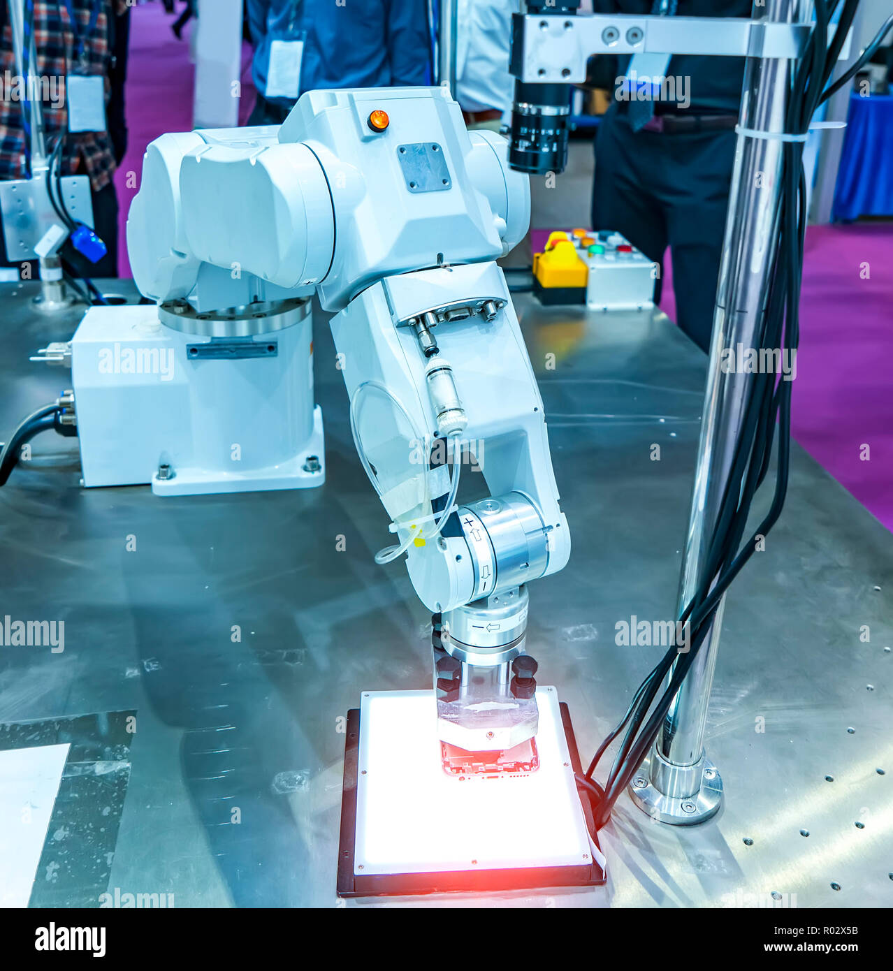 Robotic machine vision system in phone factory Stock Photo - Alamy