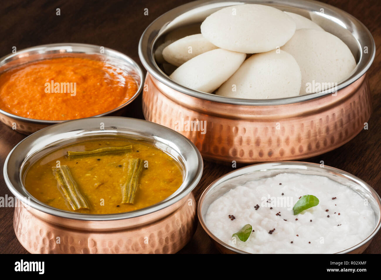 Fresh steamed Indian Idly (Idli / rice cake) arranged in authentic ...
