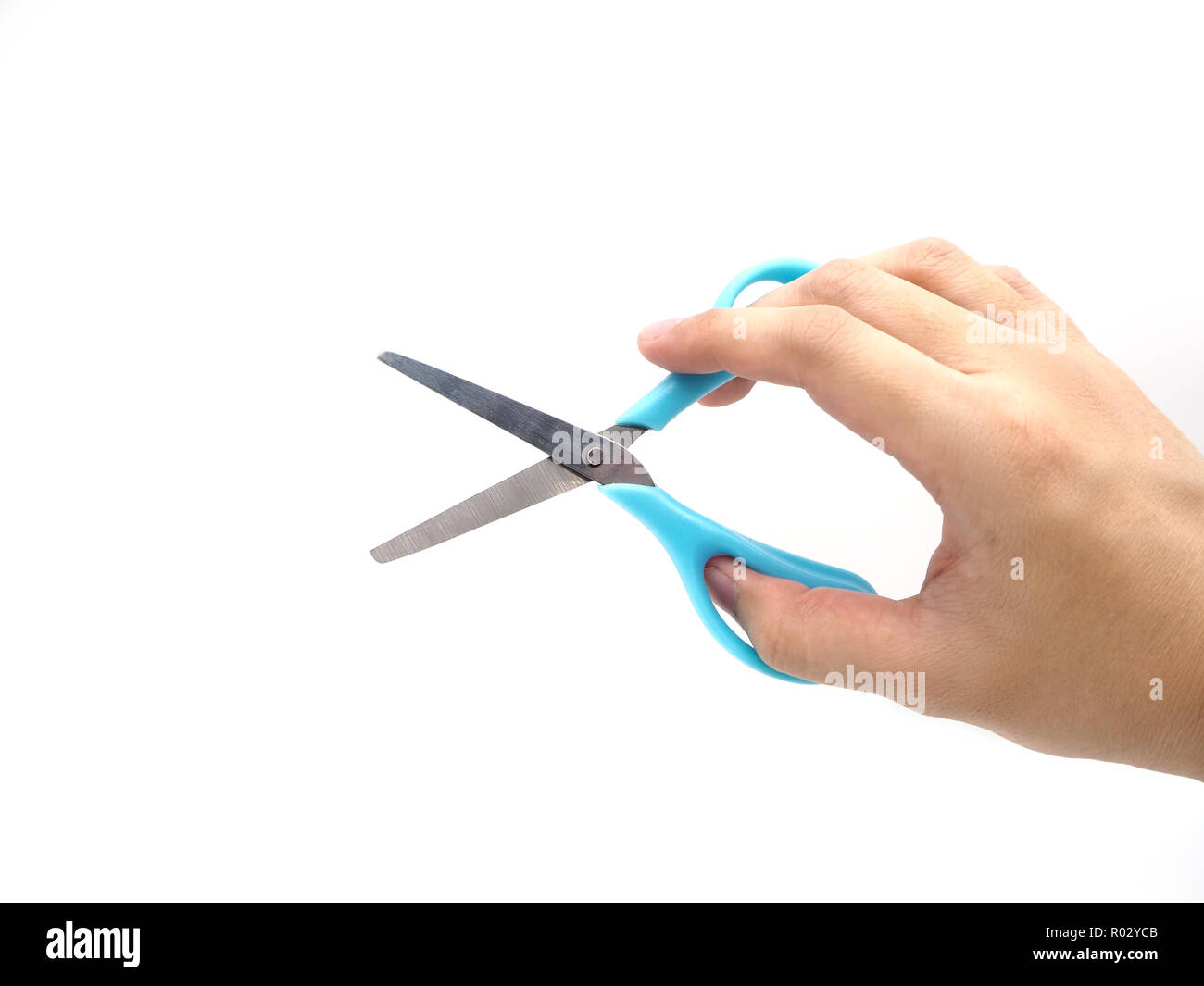Hand holding a scissors isolated on white background Stock Photo - Alamy