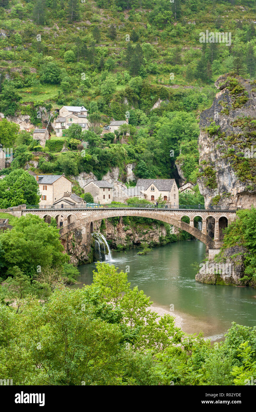 Old stone houses nestled in the Hillside of the Gorges du Tarn above ...