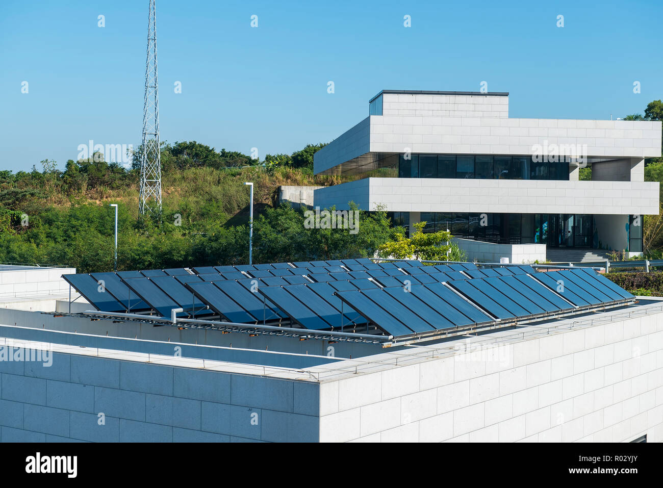 Solar water heating panel on a house roof Stock Photo - Alamy