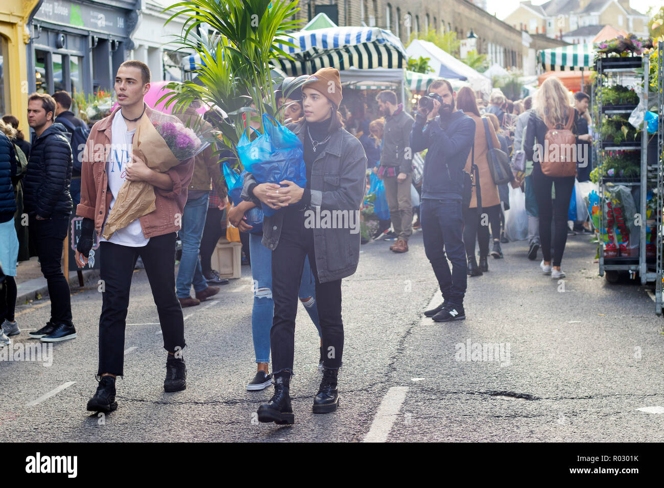 LONDON, ENGLAND - October 12, 2018 Group of young friends walking in ...